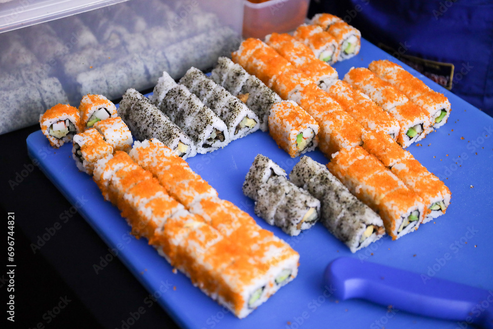 Japanese sushi food dish display. Maki ands rolls with tuna, salmon ...