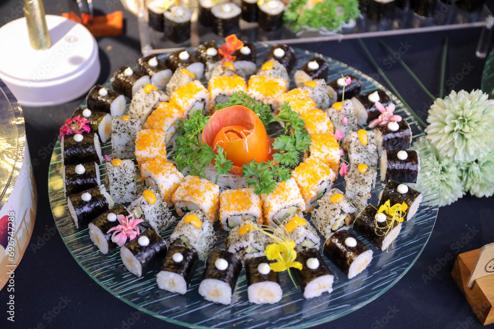Japanese sushi food dish display. Maki ands rolls with tuna, salmon ...