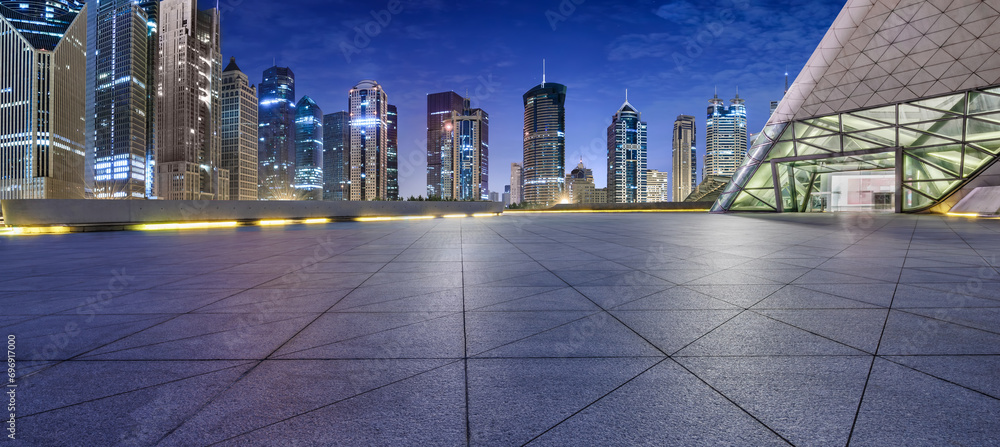 City square floor and modern commercial building scenery at night in ...
