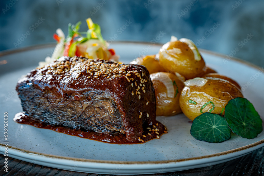 Costillas Poblanas - Mole-braised short ribs with roasted garlic ...