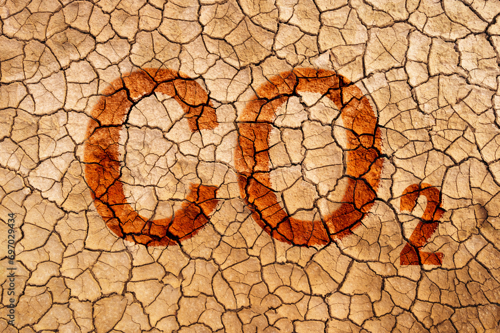 Cracked earth with word CO2. Global warming, climate change concept ...