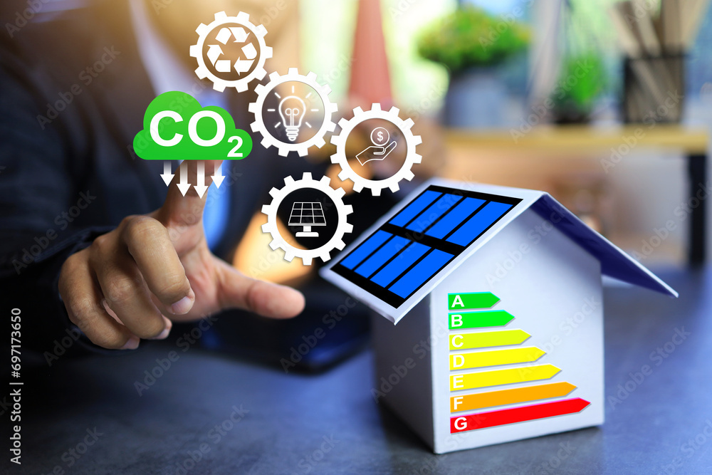 House energy efficiency rating concept with businessman pointing on co2 ...