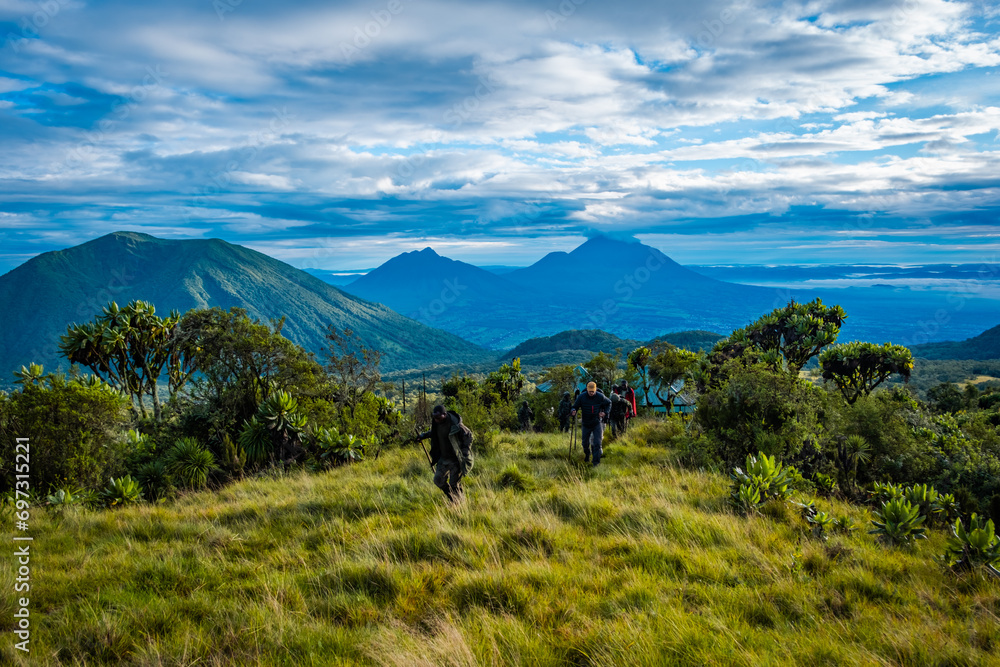 Range of Rwandan volcanoes Bisoke, Sabyinyo, Gahinga and Muhabura while ...