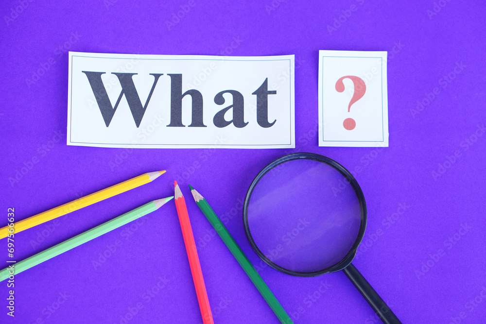Paper cards with Wh-question words and question mark on purple ...