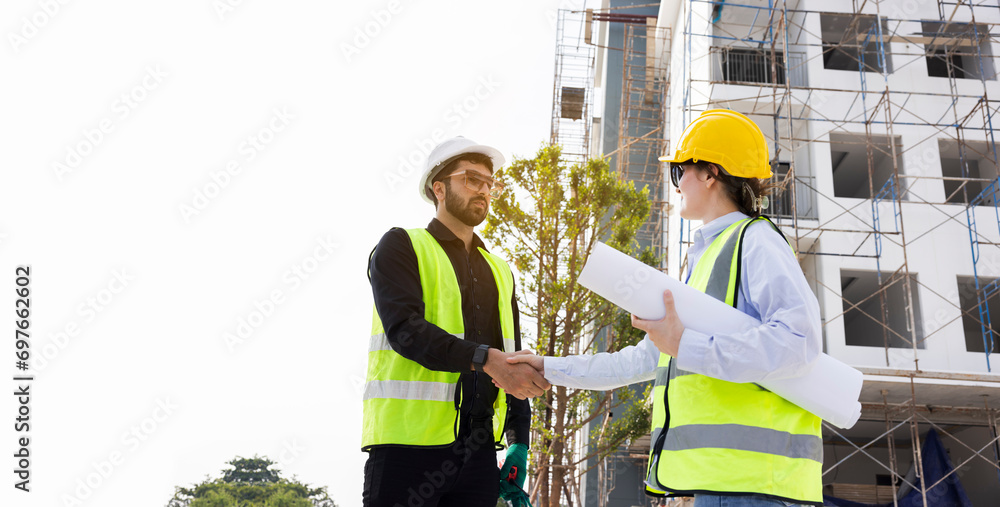 The architect team shake hands and joins in the construction work ...