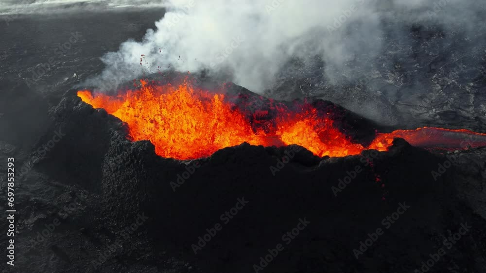 Volcano eruption, red hot burning lava erupts from ground, drone fly ...