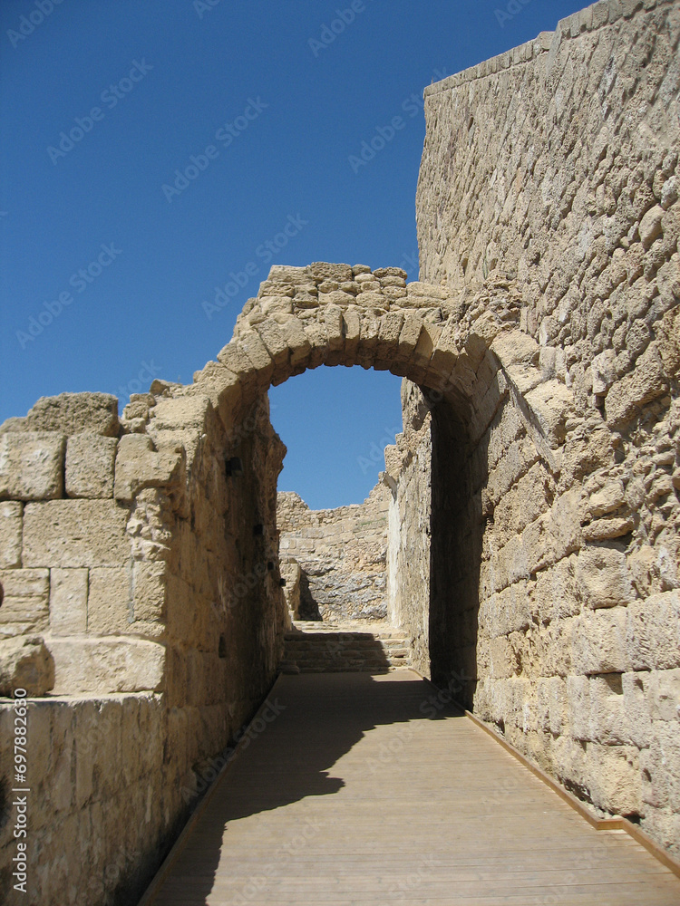 Ancient Roman ruins with stone arch and walls on Caesarea maritima ...
