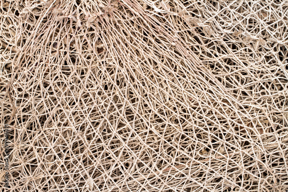 Texture of an old fishing net. A tangled net of rope. Stock Photo ...
