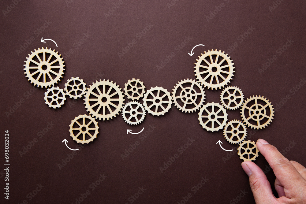Hand holding wooden cog flowing process management. Stock Photo | Adobe ...