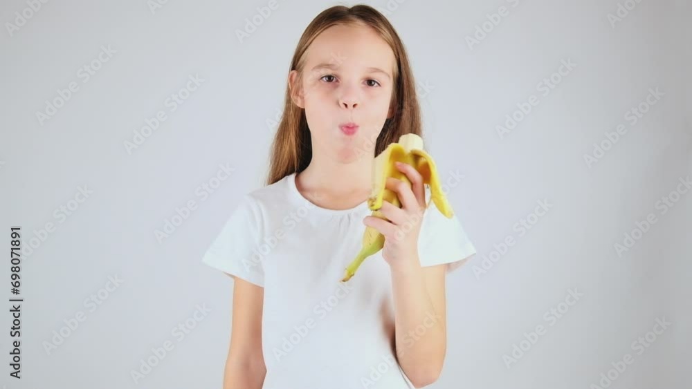 Close-up preteen girl enjoying healthy food. Portrait little girl in ...