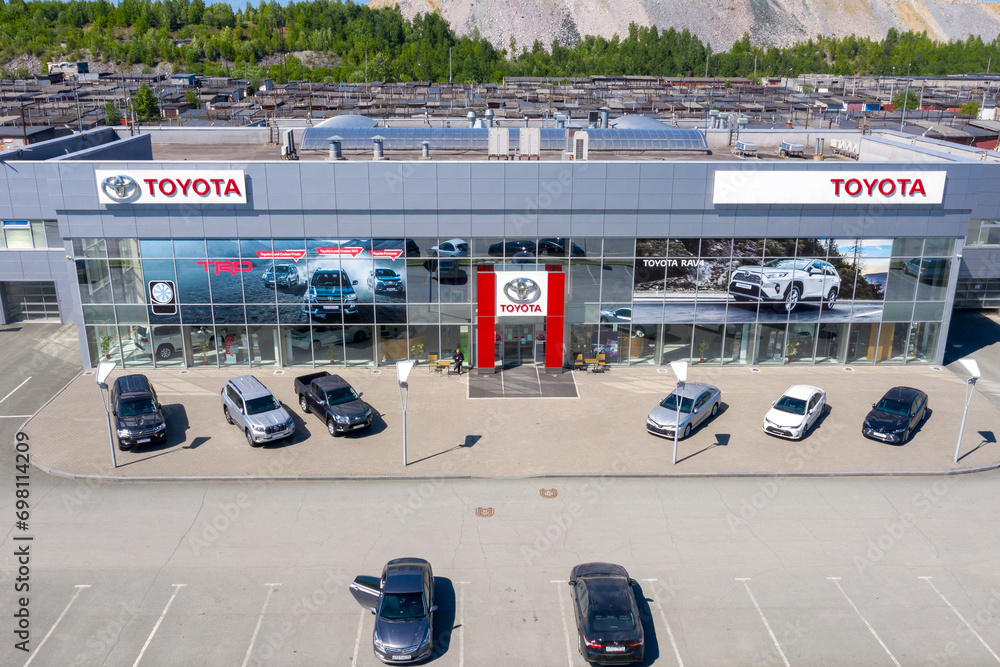 Toyota dealership with modern facade and cars on display in front of ...