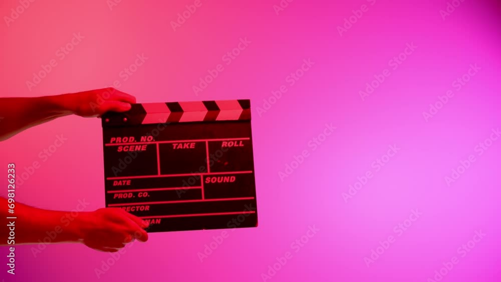 Vidéo Stock Hand is holding Black clapper board or movie slate on a ...