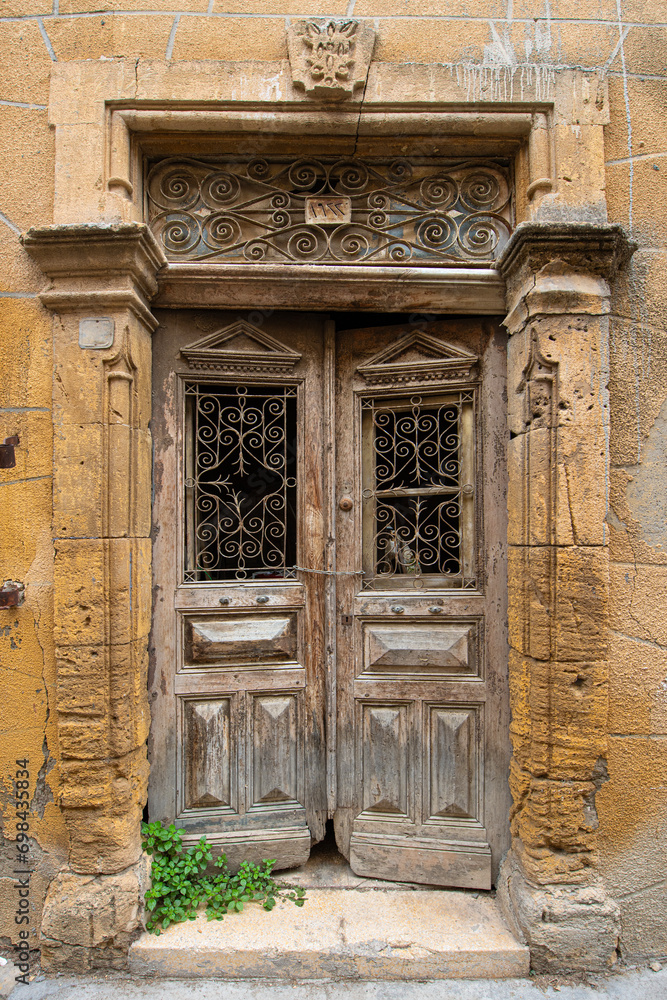 Old historical colorful doors and shutters made of wrought iron and ...
