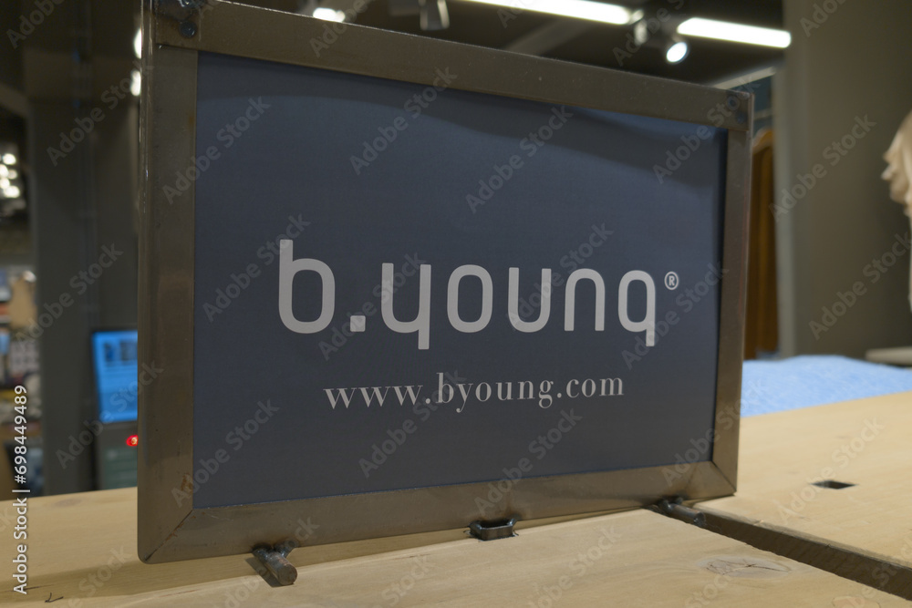b.young logo text facade and brand sign entrance fashion shop clothes ...