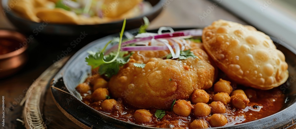 Chhole Bhature includes spiced chickpeas and deep-fried bread, a ...