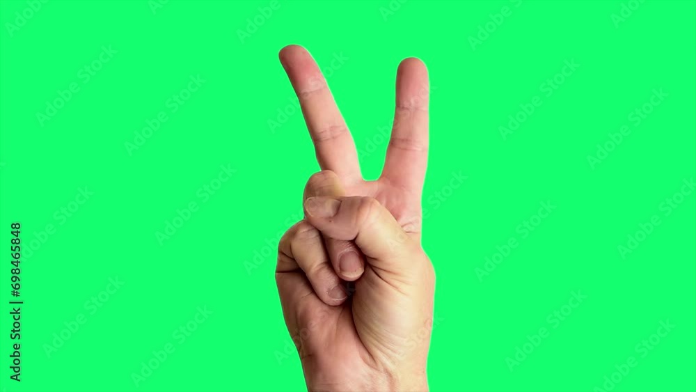 Close up shot of a male hand throwing a classic peace sign, against a ...