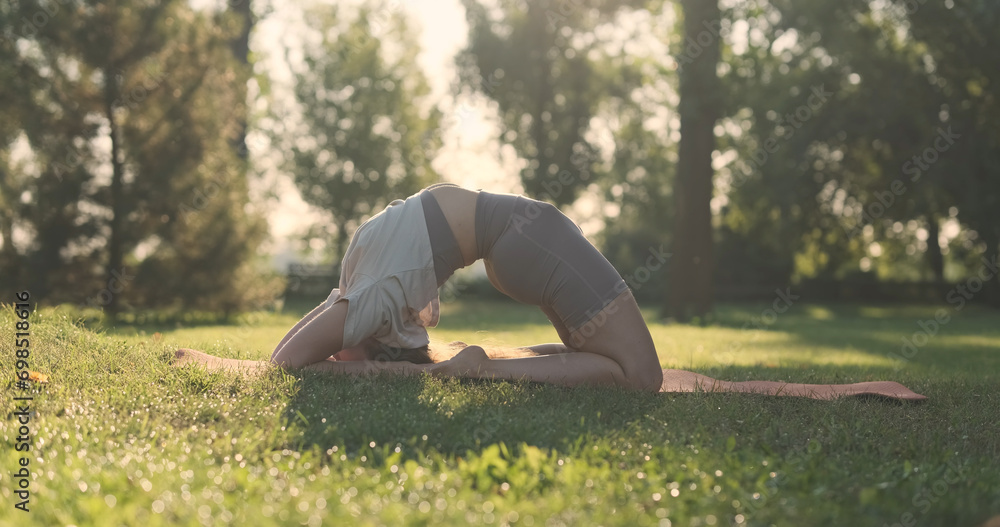 Yoga exercises coach, pigeon pose, Kapotasana, long hair woman sitting ...