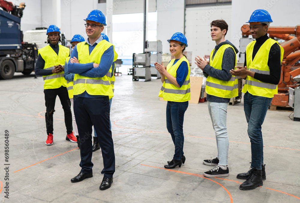 Group worker factory or engineer men and women standing with confidence ...