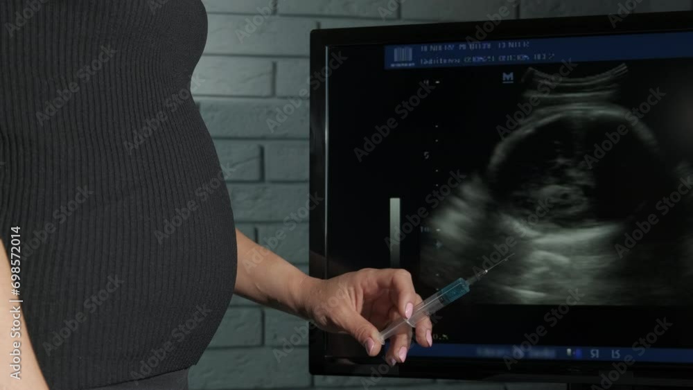 Sick pregnant with injection. A view of pregnant woman hold an ...