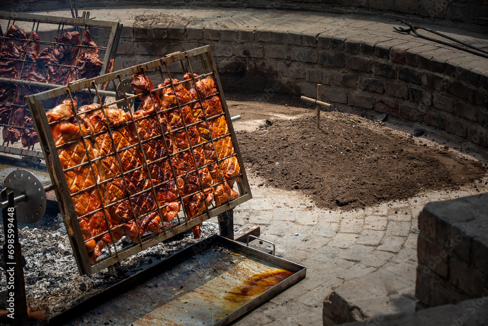 "Chancho al Palo" is a traditional Peruvian dish that involves roasting ...