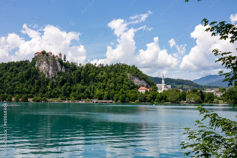 Panoramic view of St. Martina Parish Church and medieval castle at Lake Bled, Upper Carniola ...