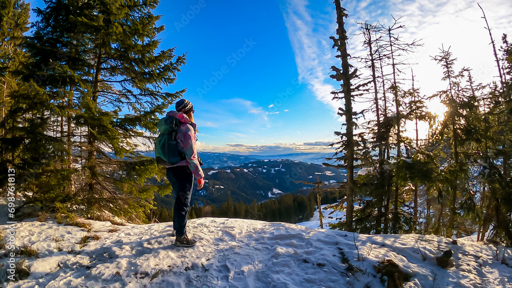 Backpack woman with scenic view of Lavant valley and Koralpe in ...