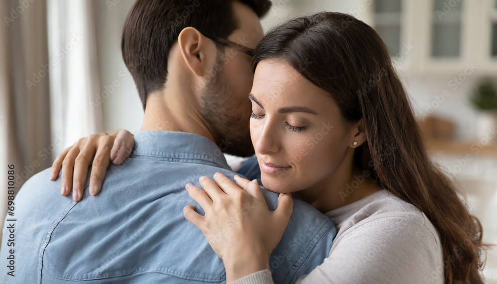 Husband embracing wife's shoulder to support each other ,Relationship ...