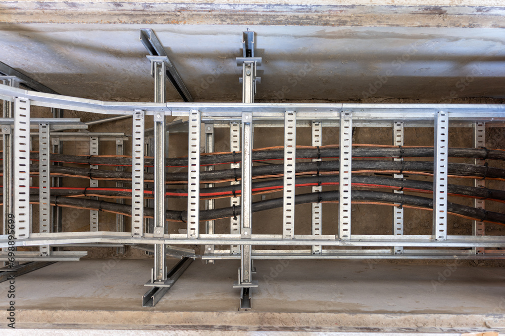 electric cable duct on a metal frame underground in a trench, cable ...