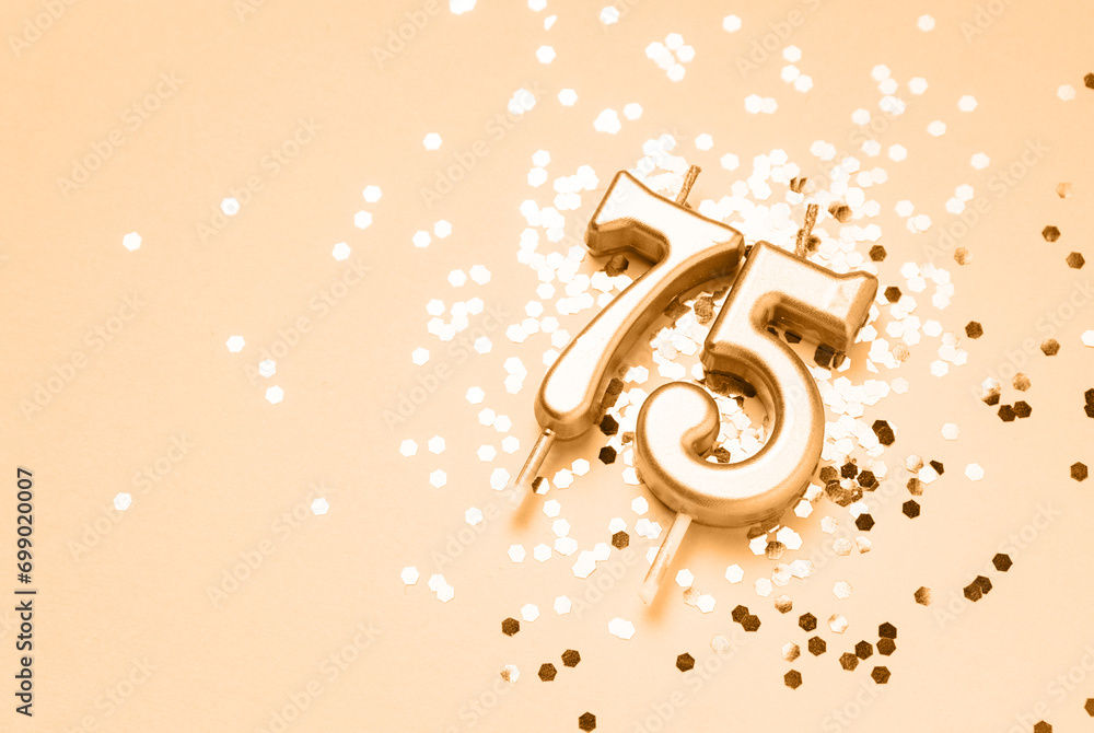 75 years celebration festive background made with golden candles in the ...