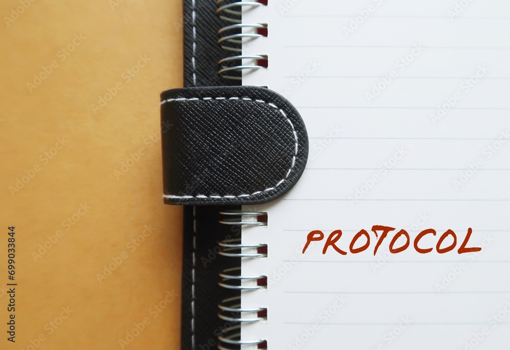 On envelope, notebook with handwritten text PROTOCOL, means official ...