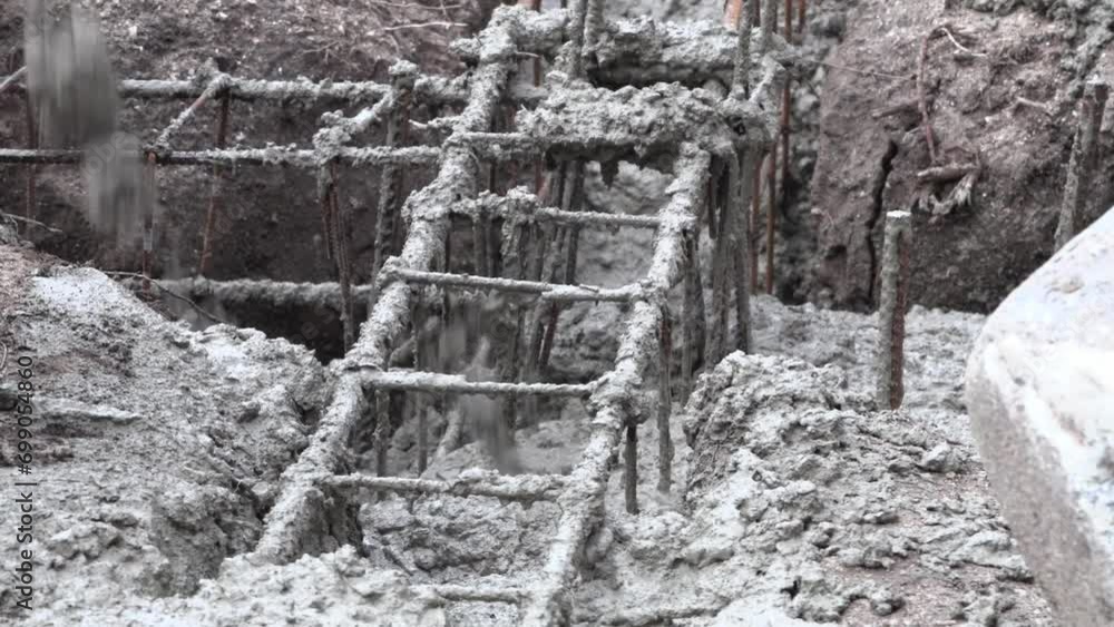 Cement mixing machine making cement into the iron beam structure of a ...