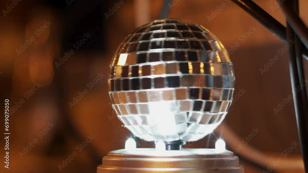 Vidéo Stock Close up footage of a small disco ball slowly rotating ...