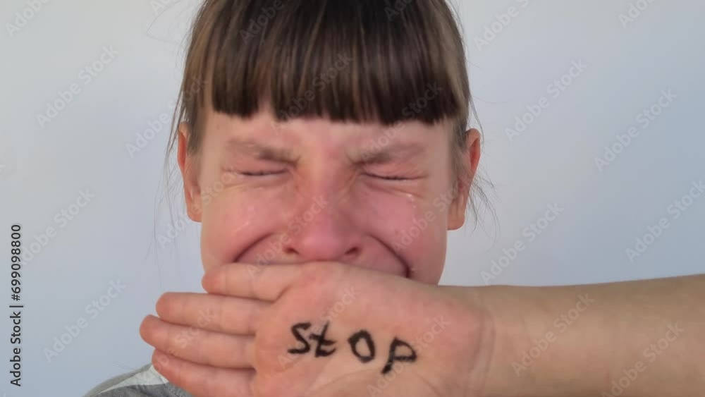Vidéo Stock Portrait of a little scared girl child and crying holding ...