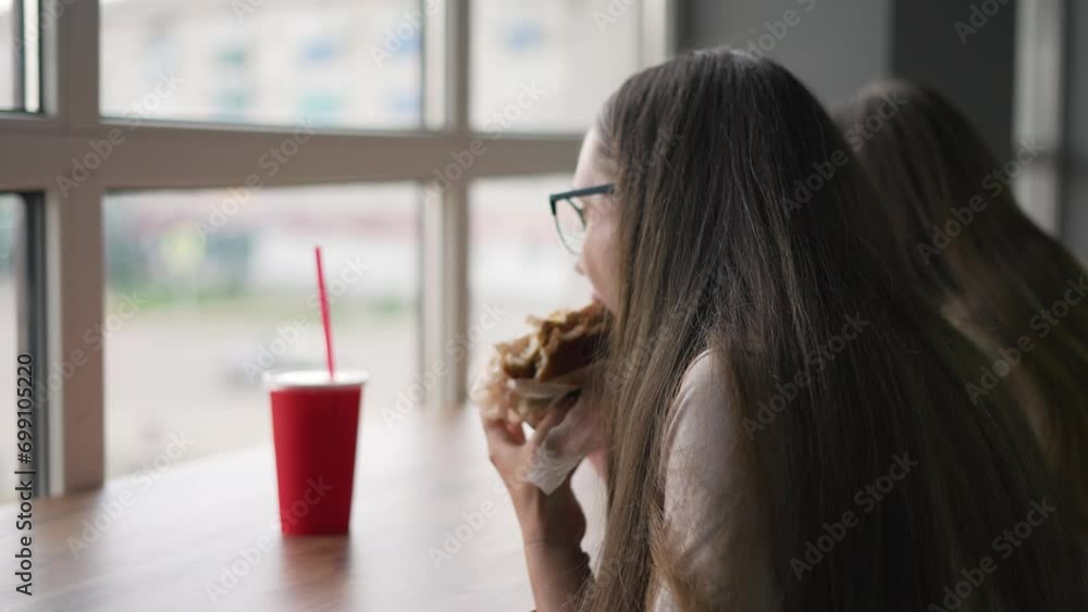Portrait of girls by window in fast food restaurant.group of people ...