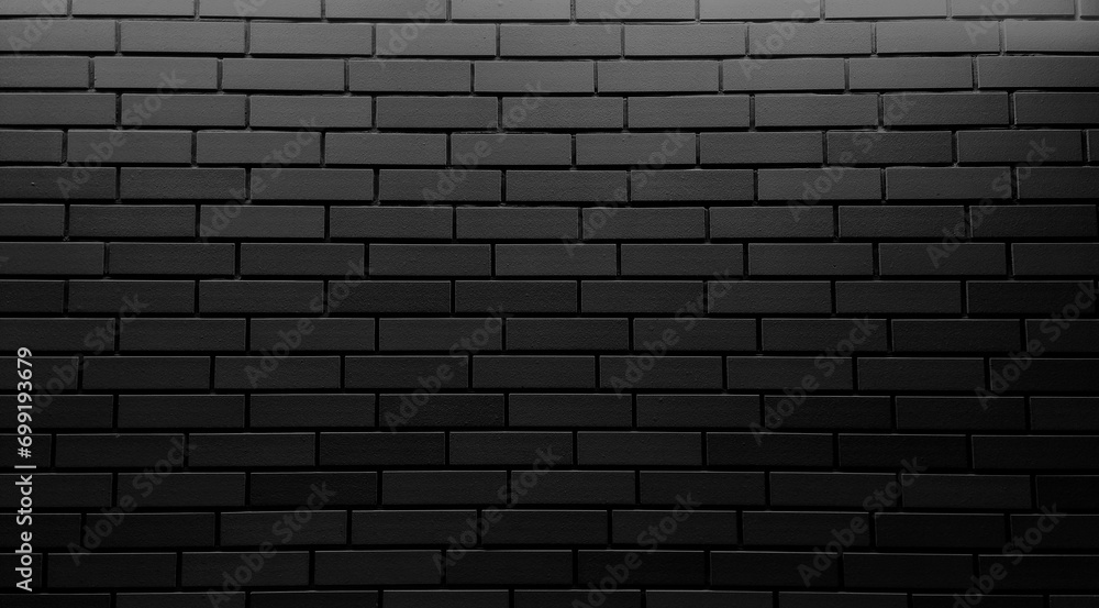 dark black modern brick tile wall use as background with blank space ...