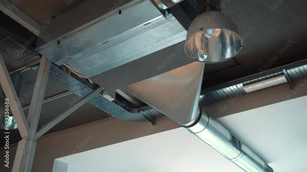 Bottom view of installed ventilation system in big space room, metal ...