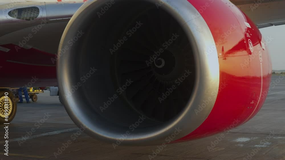 Turbine of aircraft is spinning. Airplane jet engine under wing ...