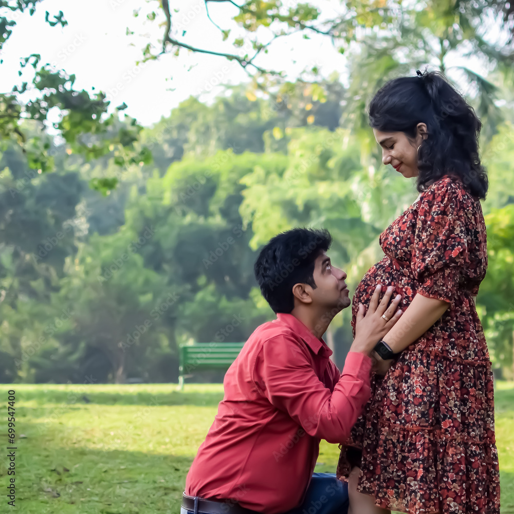 Indian couple posing for Maternity shoot pose for welcoming new born ...