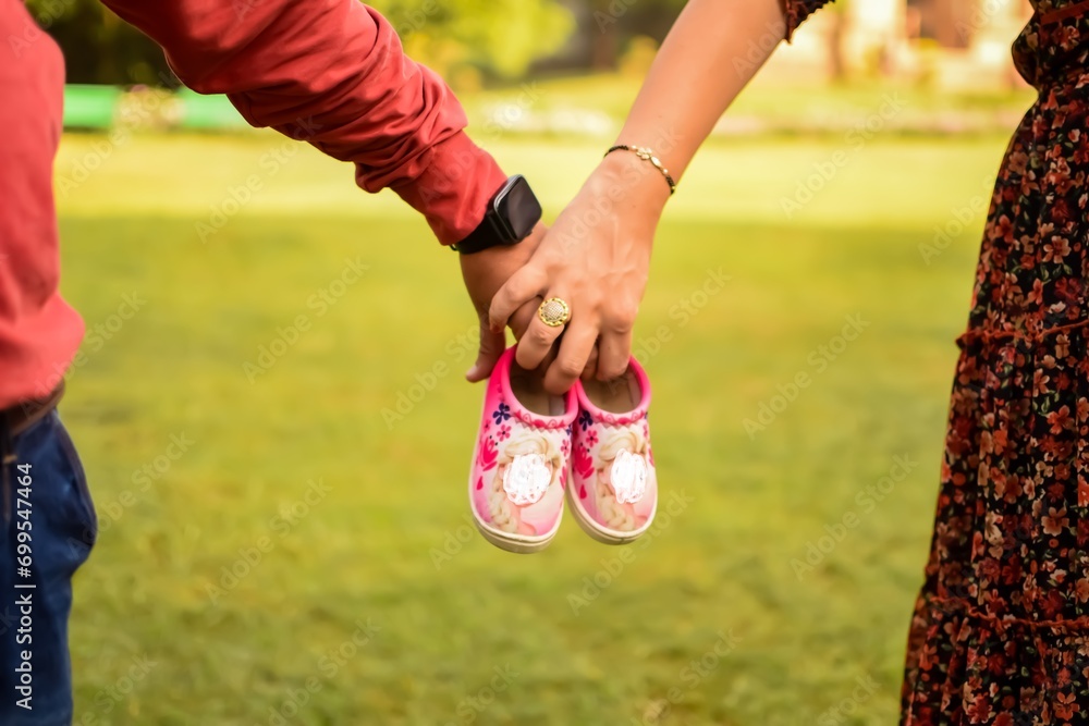 Indian couple posing for Maternity shoot pose for welcoming new born ...