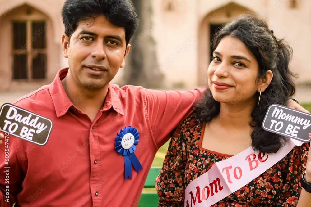Indian couple posing for Maternity shoot pose for welcoming new born ...