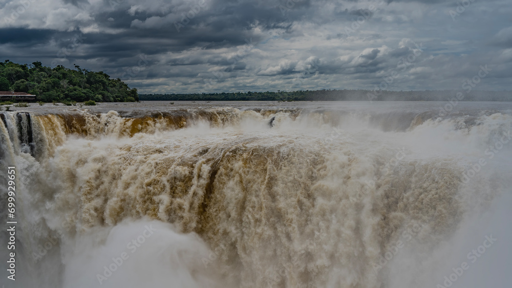 The famous Devil's Throat Waterfall. Powerful streams plunge into the ...