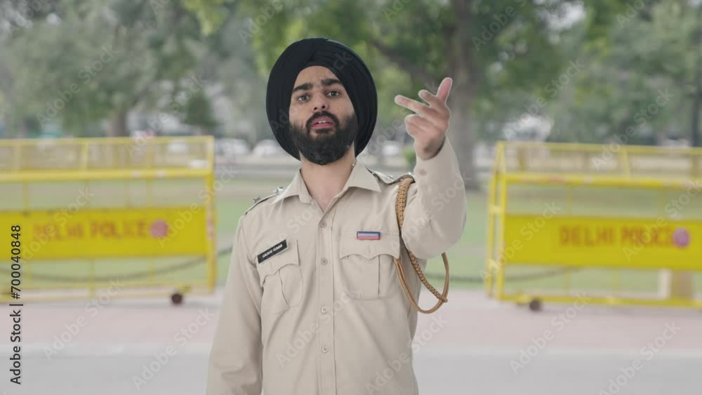 Angry Sikh Indian police man pointing and calling someone Stock Video ...