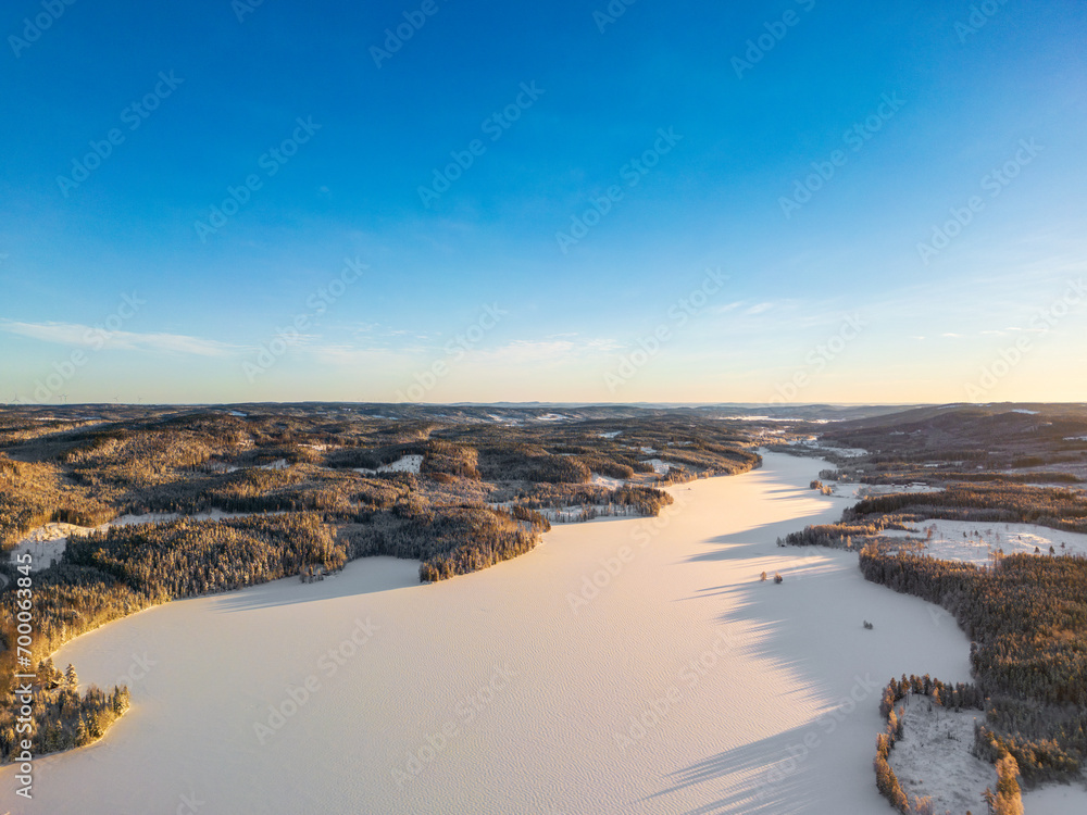 Aerial panoramic photo of a Swedish landscape , lake, cold sunny day ...