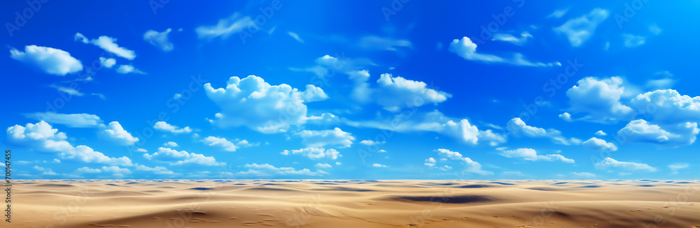Horizontal image of a desert landscape under a bright blue sky covered ...