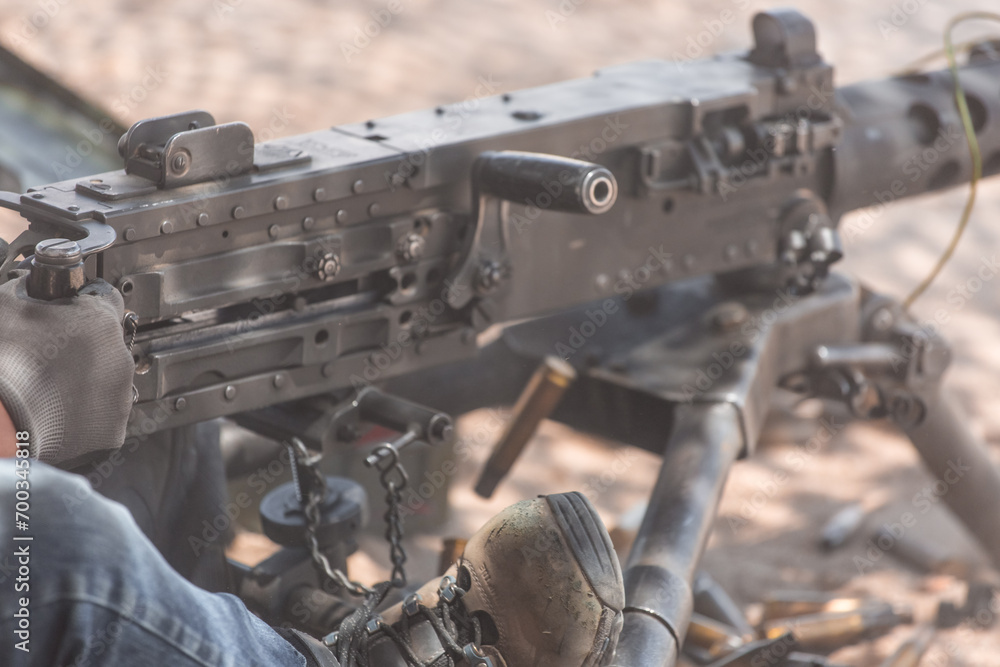 Machine gun mounted on Humvee and person shooting the .50 Caliber ...