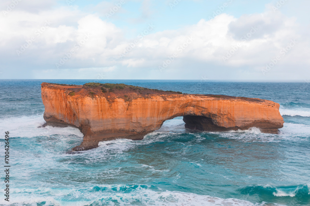 Photograph of the rock formation London Bridge against a stormy sky ...