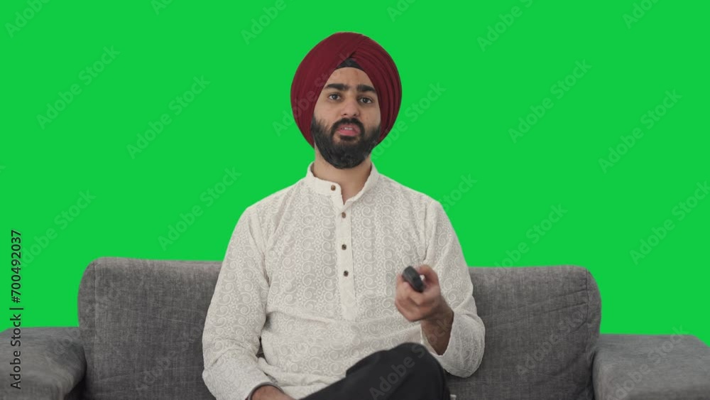 Frustrated Sikh Indian man watching TV Green screen Stock Video | Adobe ...