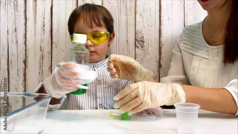 Adorable toddler doing his first scientific experiment for development ...