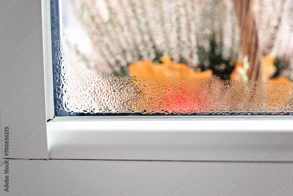 Selective focus on water condensation on window glass. Humidity in the ...
