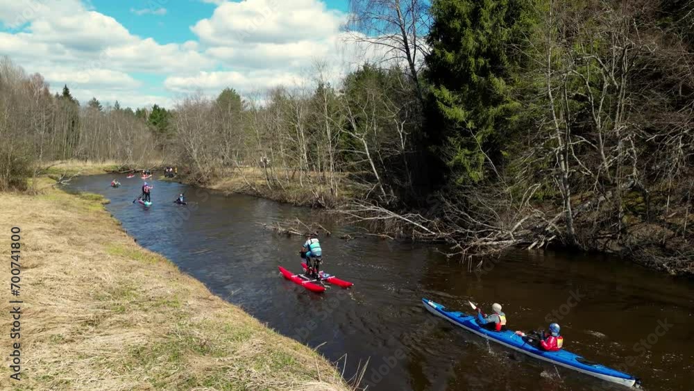 Canoeing, a type of rowing sport, follow of dual kayak going down the ...